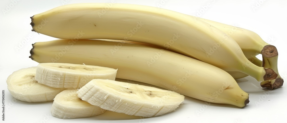 A cluster of yellowing bananas resting beside an array of slivered ...