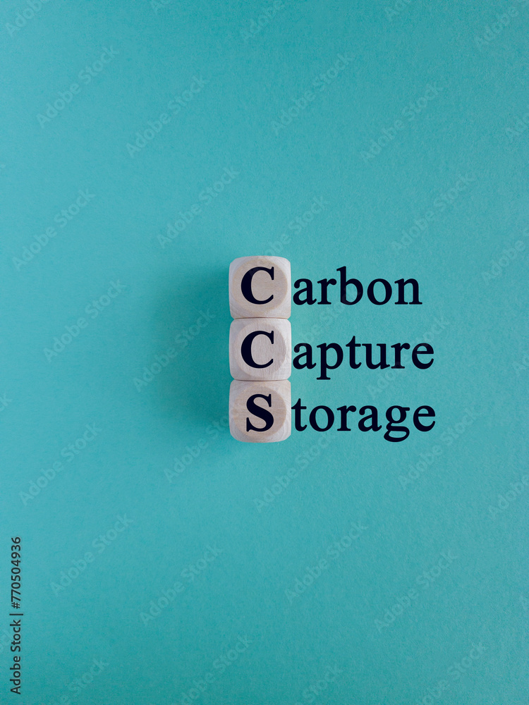 CCS (Carbon Capture and Storage) on wooden cubes on blue background ...