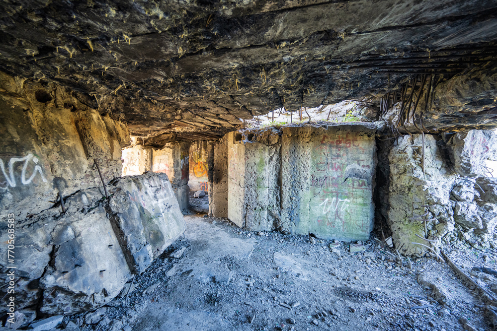 Inside the destroyed bunker from Second War World. Cracked reinforced ...