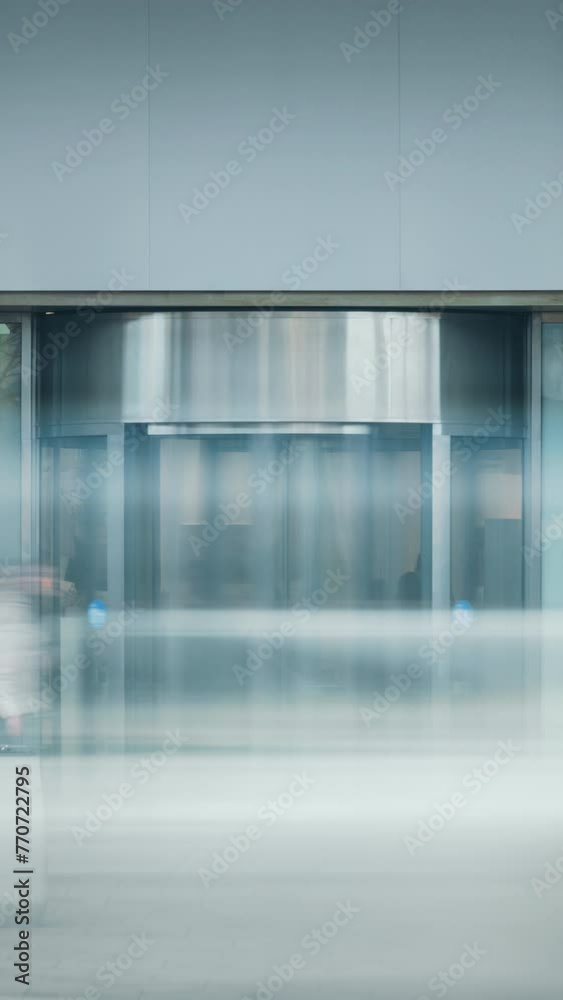 Vertical time-lapse shopping mall entrance unrecognizable people crowd ...
