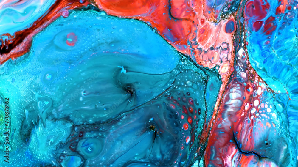 Psychedelic abstract bright multiple colors are mixed in a liquid ...
