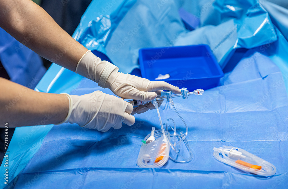 The procedure of inserting a double lumen catheter into a patient with ...