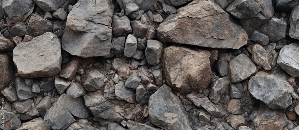 A stack of bedrock outcrop stones forms a pile on the grassy landscape ...