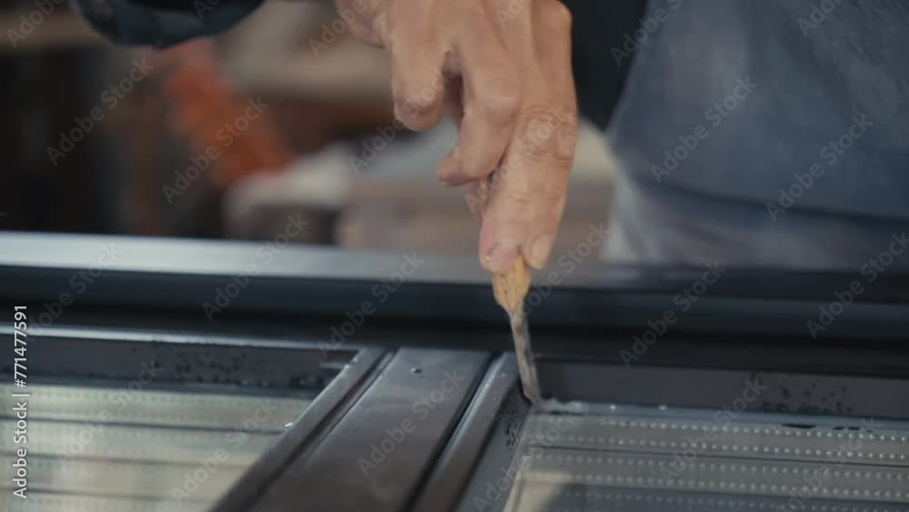 Close Up. Artisan Applying Silicon With Carpentry Tool On Wooden Window ...