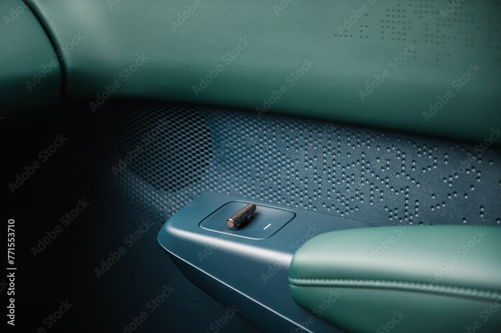 Button to open or close window in door new modern sedan automobile ...