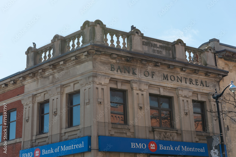 roofline and exterior facade of a historic BMO Bank of Montreal branch located here at 2859 ...
