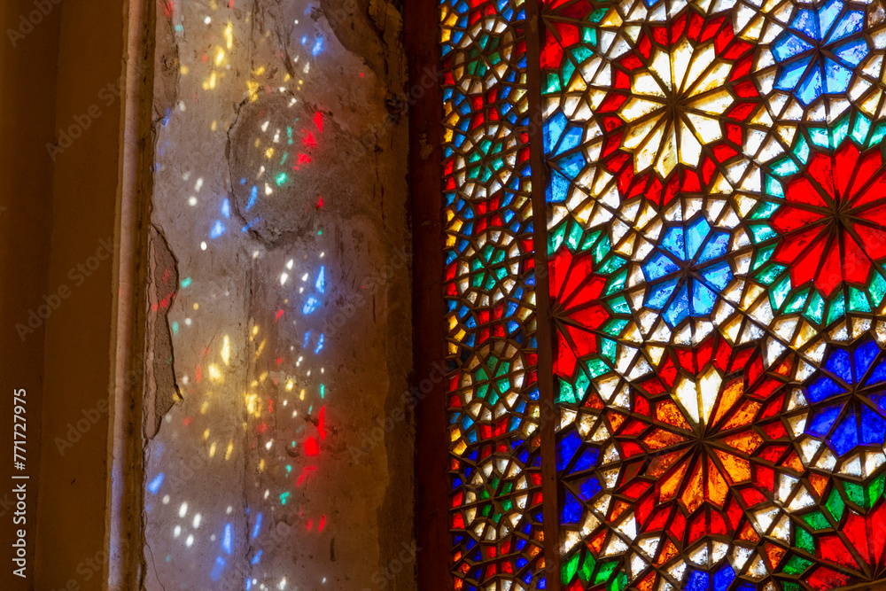 Colorful stained glass window in the ancient Persian Dowlatabad mansion ...