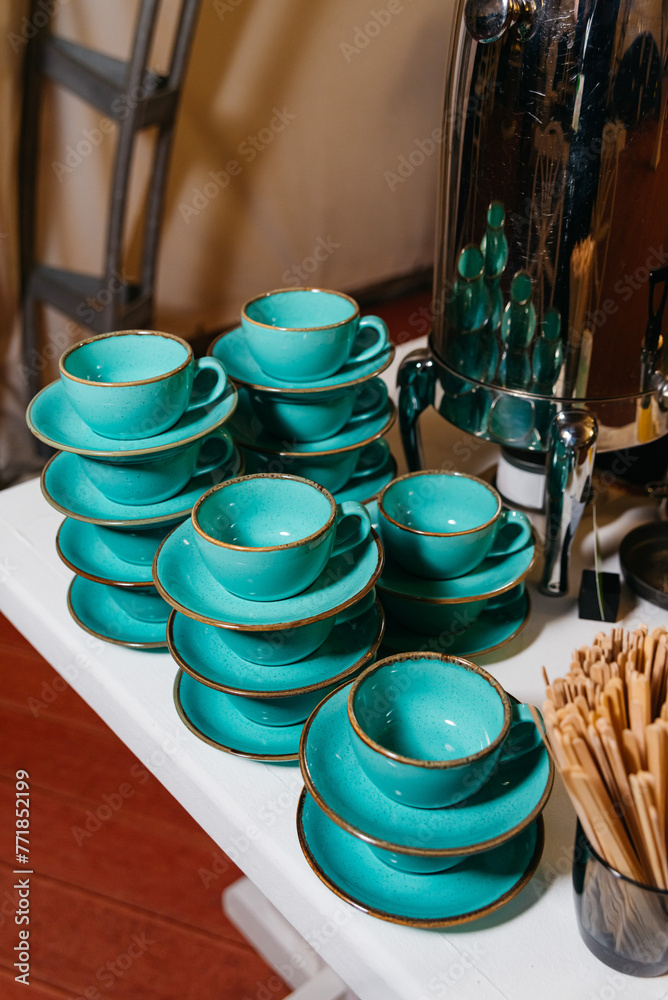 Turquoise Ceramic Coffee Cups on Display. Stacks of elegant turquoise ...