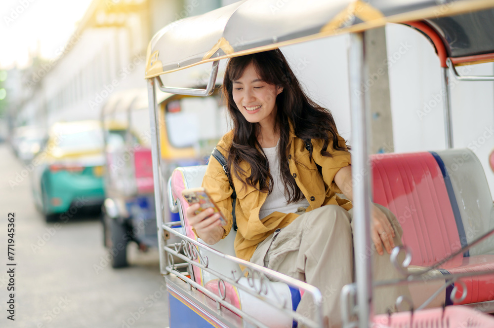 Attractive beautiful tourist woman or traveler woman sitting on tuk tuk ...
