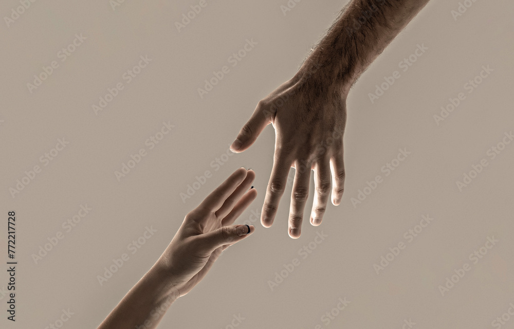 Male and female hands reach towards each other. Helping hand concept ...