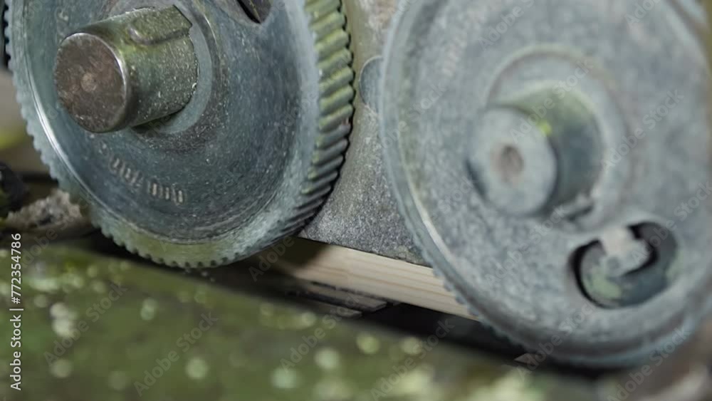 Close Up Of Mechanism For Lumber Production. Timber Plank Moves Between ...