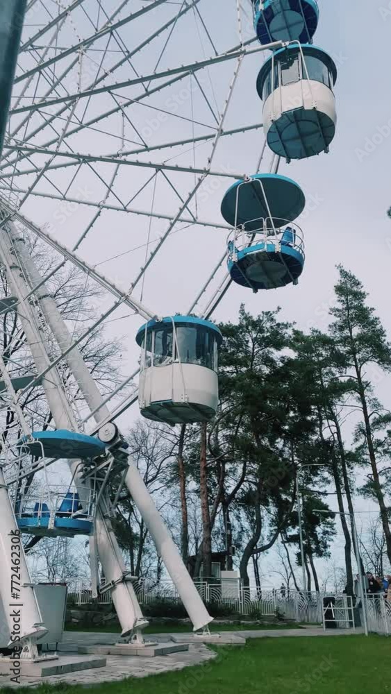 Ferris wheel, or devil's wheel, an amusement park ride, underside or ...