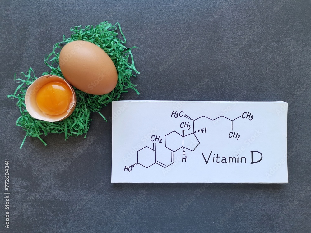 Structural chemical formula of vitamin D with fresh eggs. Egg yolk, a ...