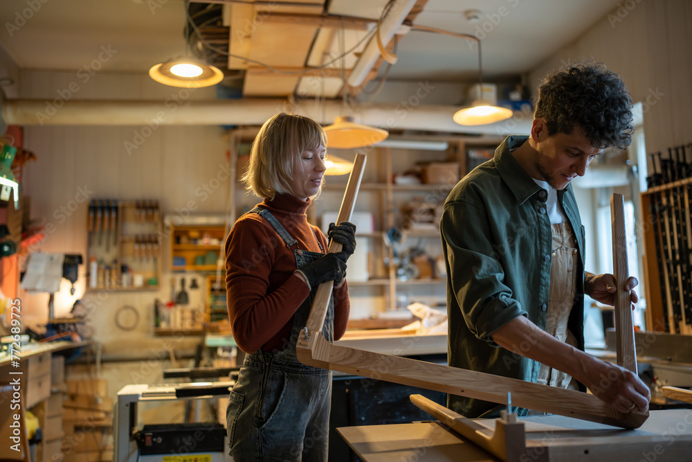 Carpentry workshop, craftsmen working together. Professional craftsman ...