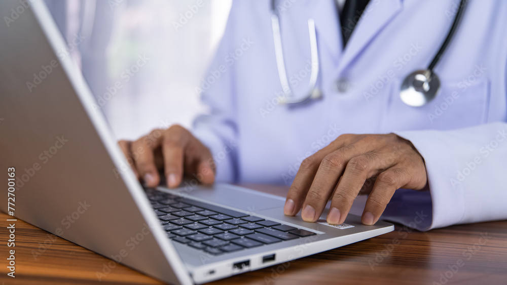 Doctors use computers to record treatment data into the hospital's data ...