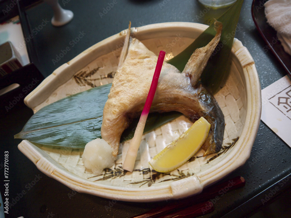 Plate of japanese hamachi kama meal, buri amberjack deep fried fish ...