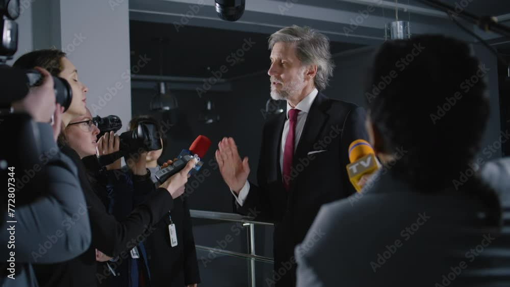 Video Stock Confident and serious male diplomat or businessman talks ...