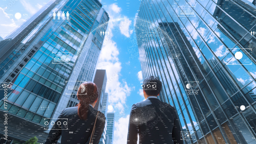 business professionals gazing at skyscrapers with digital data ...