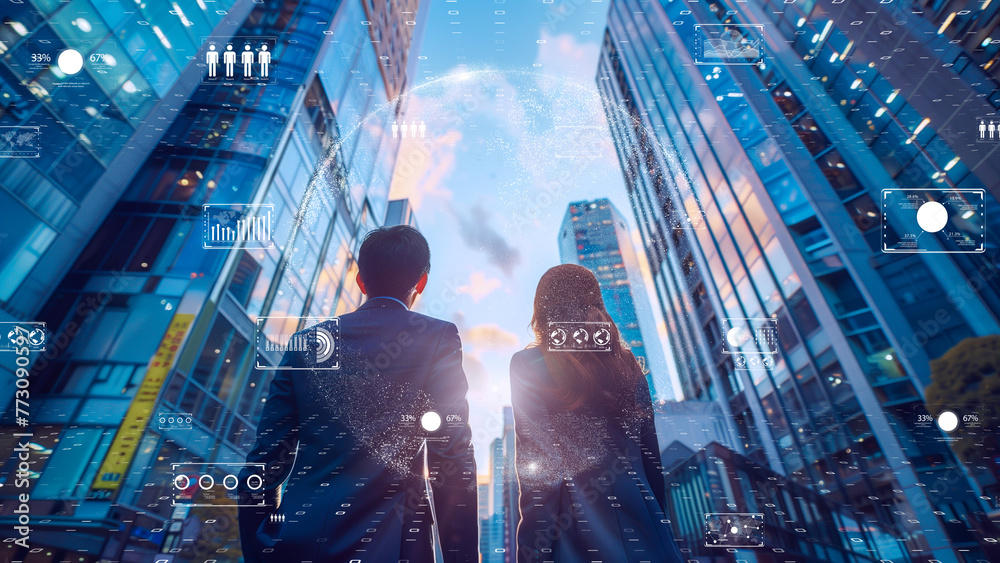 business professionals gazing at skyscrapers with digital data ...