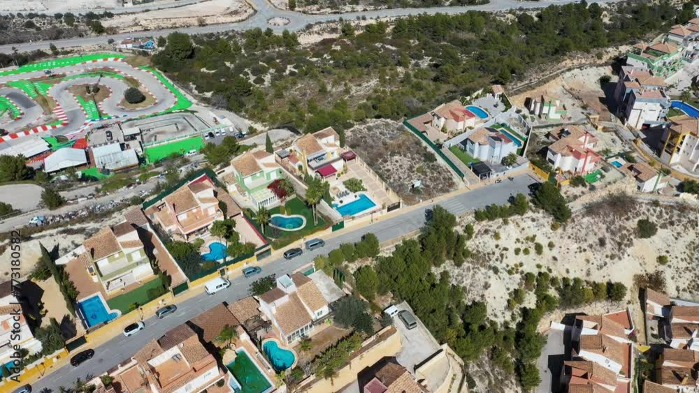 Aerial drone footage of a beautiful house in the town of Benidorm in ...