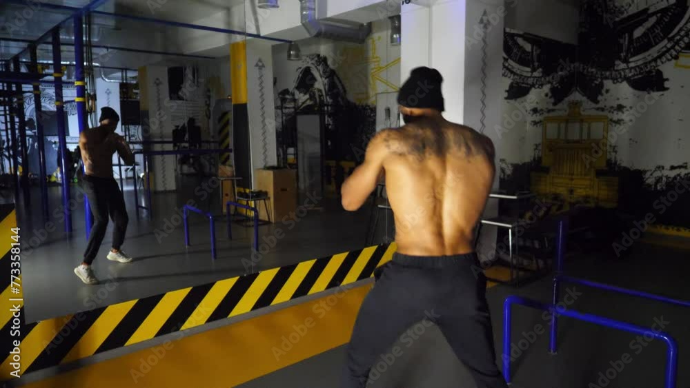 Vidéo Stock Young afro american sportsman practicing shadow boxing at ...