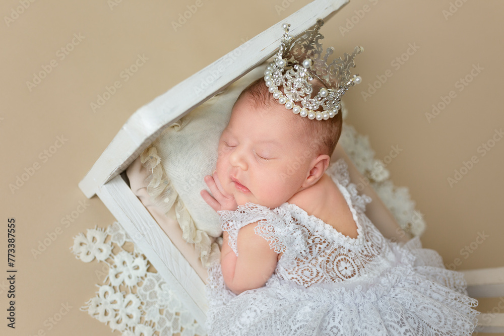 little novonarozhena child in her crib. photo session of the newborn ...