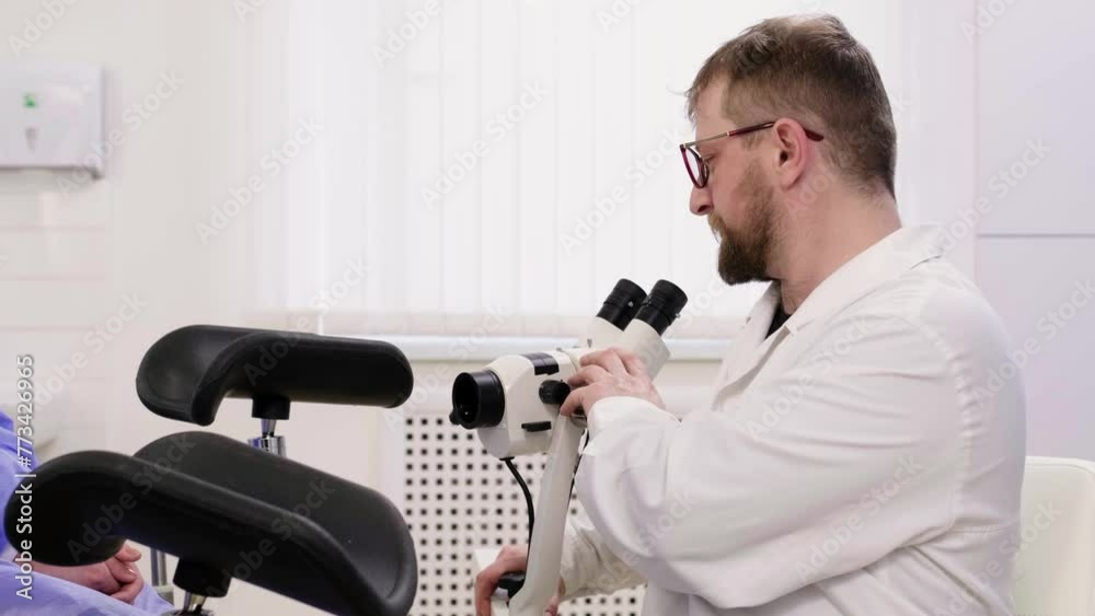 A gynecologist performs an examination in a modern gynecological ...