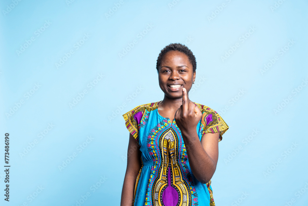 Angry rude female model showing the middle finger on camera, expressing ...