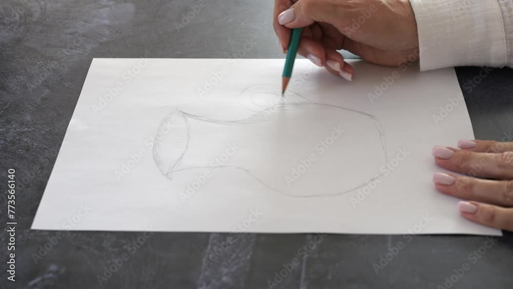 Artist woman creates art sketch on paper using pencil She demonstrates ...