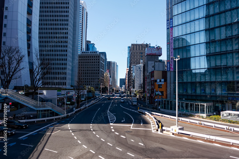 Cityscape with skyline and skyscrapers and multiple lane road seen from ...