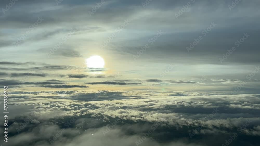 Cloudscape. Pilot POV. Real time flight from an airplane cockpit with ...