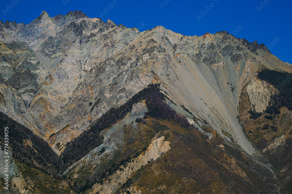 Rocky mountain with different minerals and a triangular shape in ...