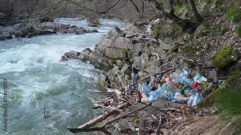 uncultured people throw garbage into the river, fast water carries ...