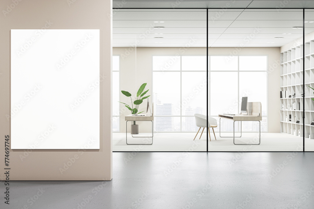 A modern office interior with a blank poster on the wall, glass ...