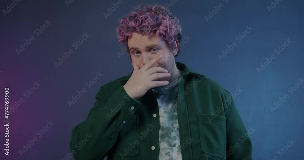 Slow motion portrait of ashamed young man doing face palm hand gesture ...