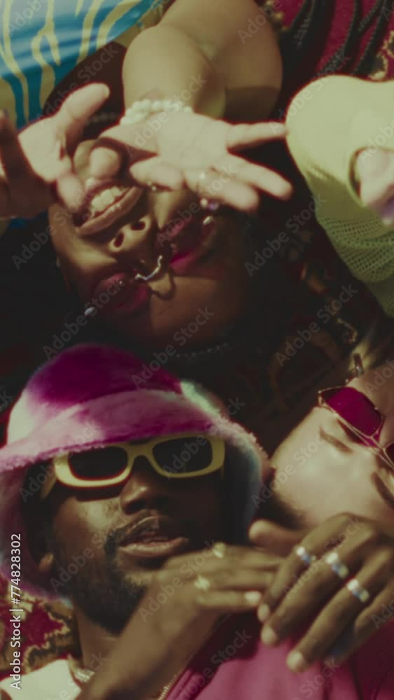 Vertical top view slowmo of two multiethnic young beautiful women and ...