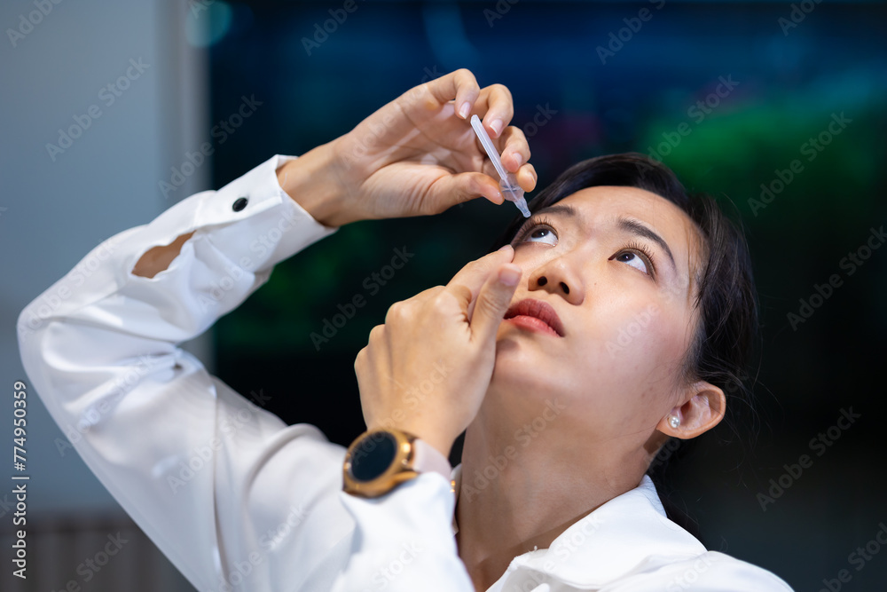 eye drop. Asian young woman dropping eye lubricant to treat dry eye ...