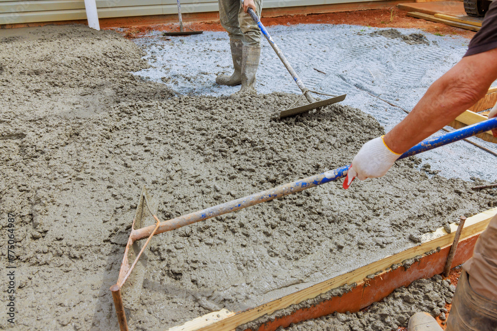 Construction worker leveling of concrete by using special tools Stock ...