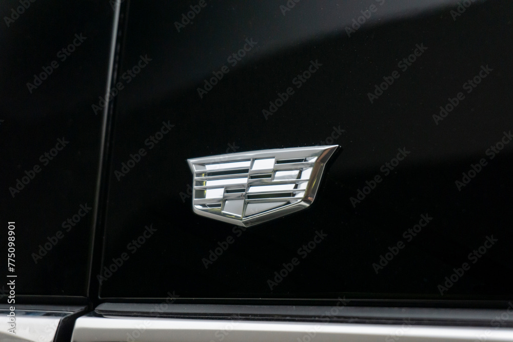 Cadillac Escalade side badge in chrome, black background, close up view ...