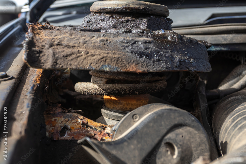 a damaged car, got into an accident. a strut with a shock absorber and ...