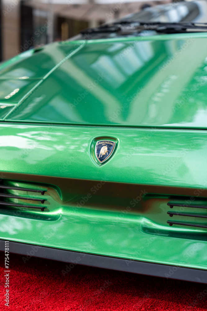 Close up of lamborghini bull badge on black background under hood of ...