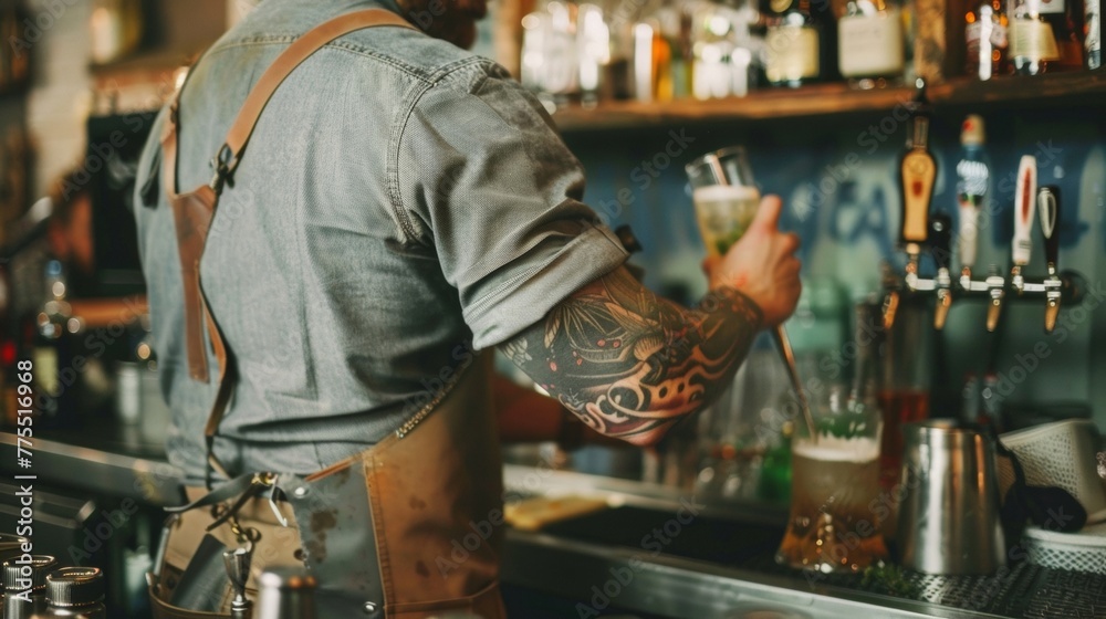 A burly bartender stands behind the bar with back to the camera ...