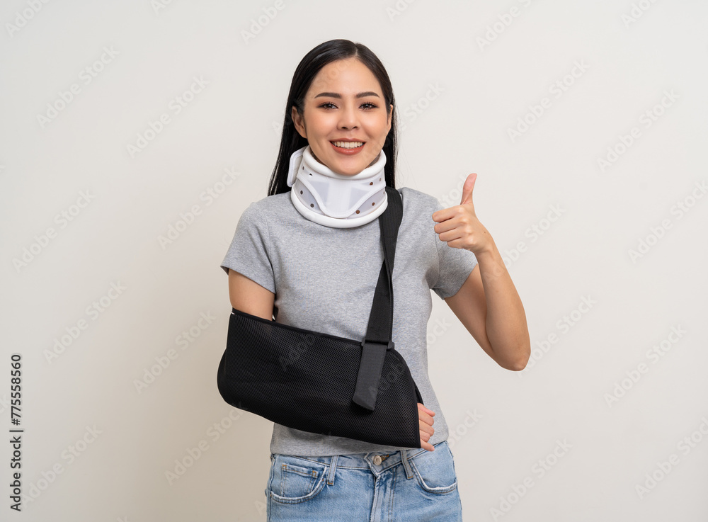 Happy young asian woman broken arm on isolated background. Asian female ...