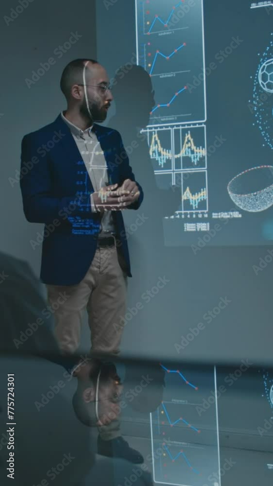 Full vertical shot with reflection of male scientist presenting ...