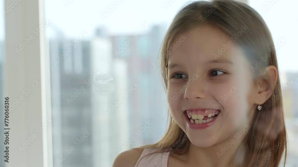 Funny girl kissing her reflection on a window. Cute girl kissing the ...