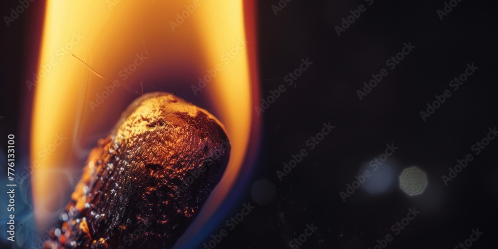 Ignited matchstick with vibrant flame and smoke against a dark ...