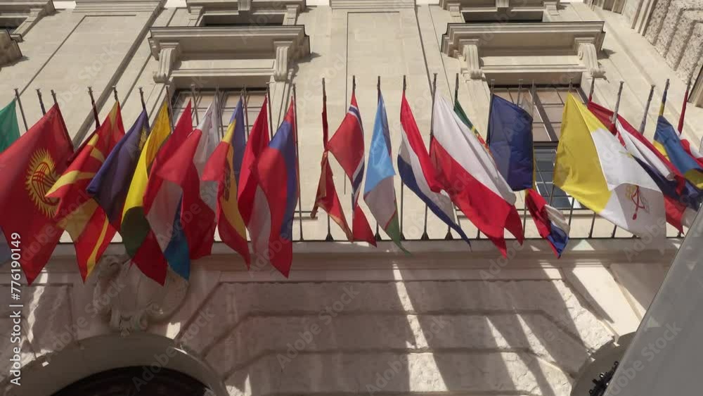 Vienna, Austria Flags of the world blowing in the wind on the Hofburg ...