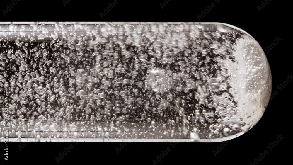 Close up tablet of aspirin, vitamin falls into of water in glass test ...