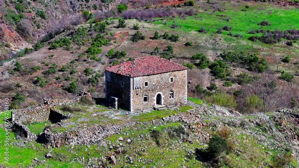 Aerial video of a historical abandoned fortified house build on the top ...