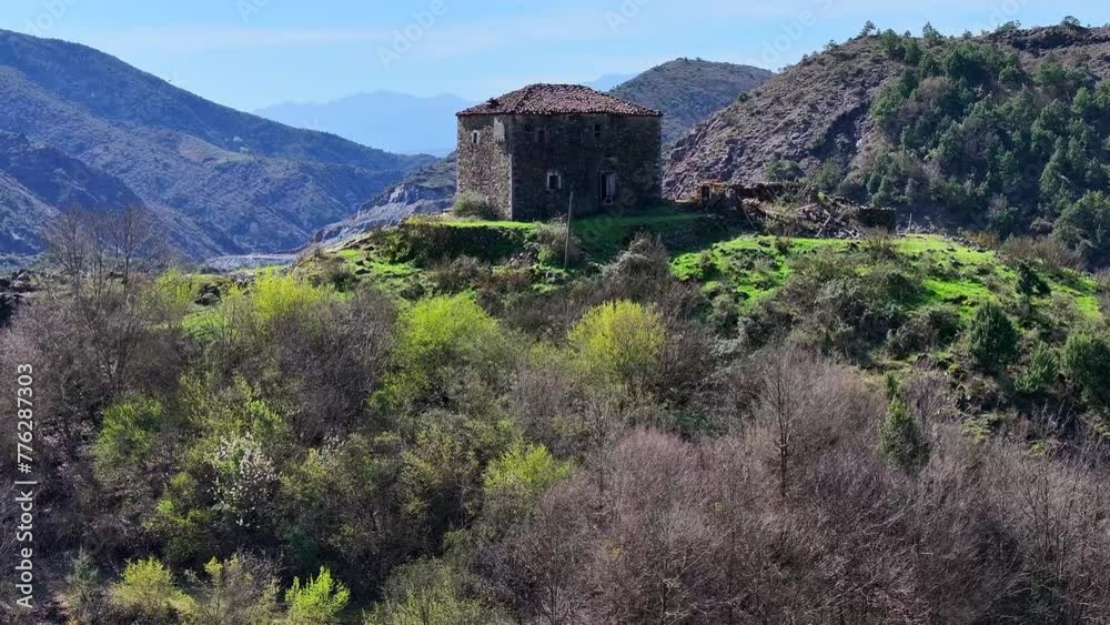 aerial video of a historical abandoned fortified house build on the top ...